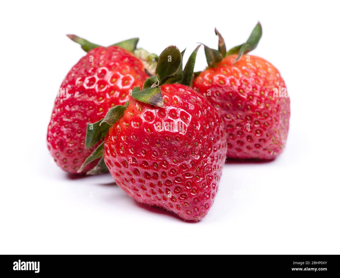 Heap of strawberry isolated on white background Stock Photo - Alamy
