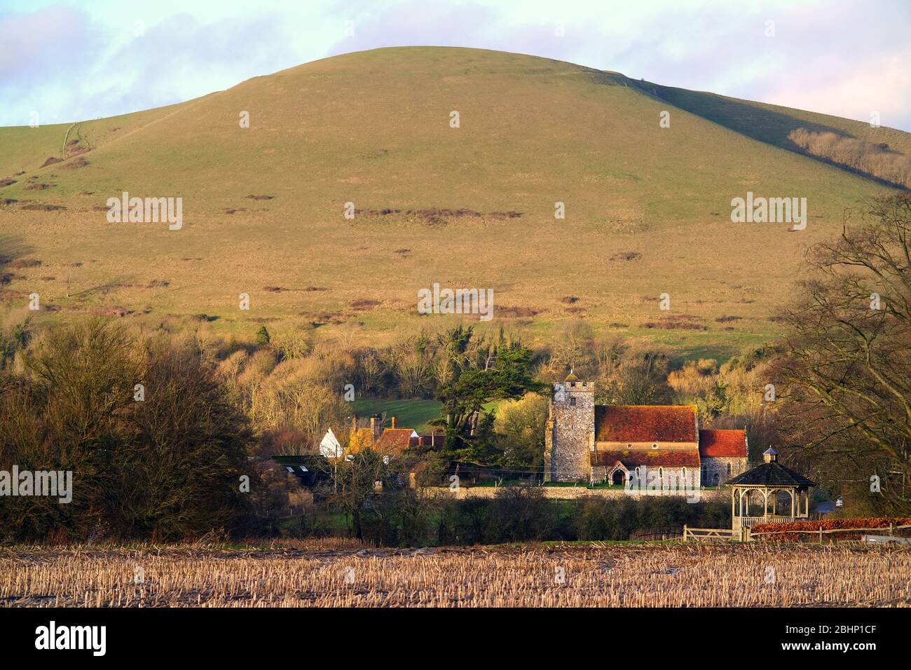 Beddingham church and Mount Caburn Iron Age fort in the South Downs ...