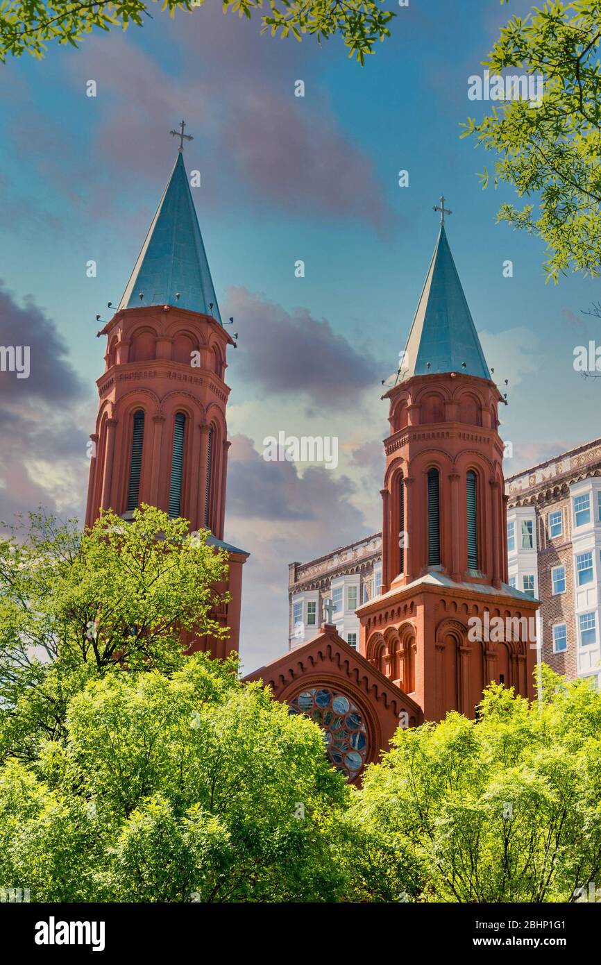 Two Red Brick Steeples with Metal Roof Stock Photo - Alamy