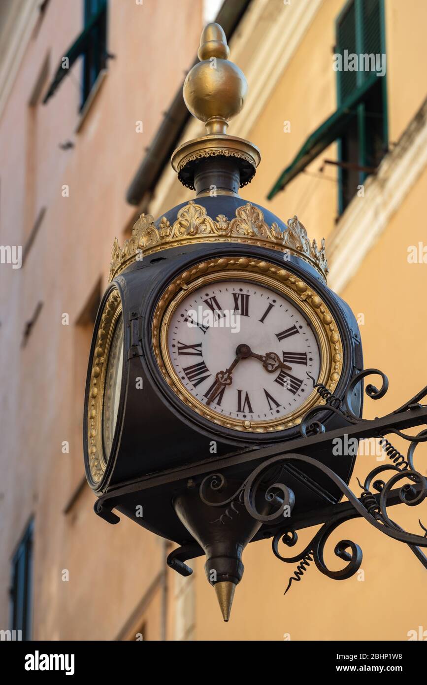 Old stylish clock on a street corner Stock Photo - Alamy