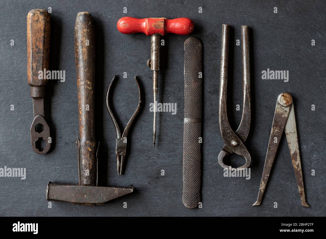 very old tools on black background Stock Photo - Alamy