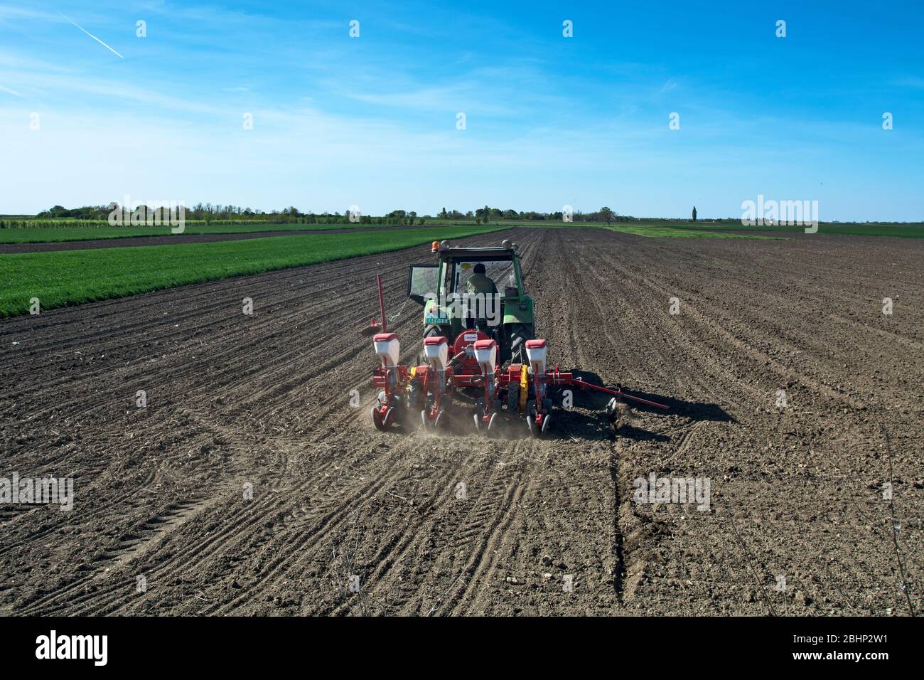 Curug, Serbia, April 20, 2018. Spring sowing. A farmer with a tractor ...