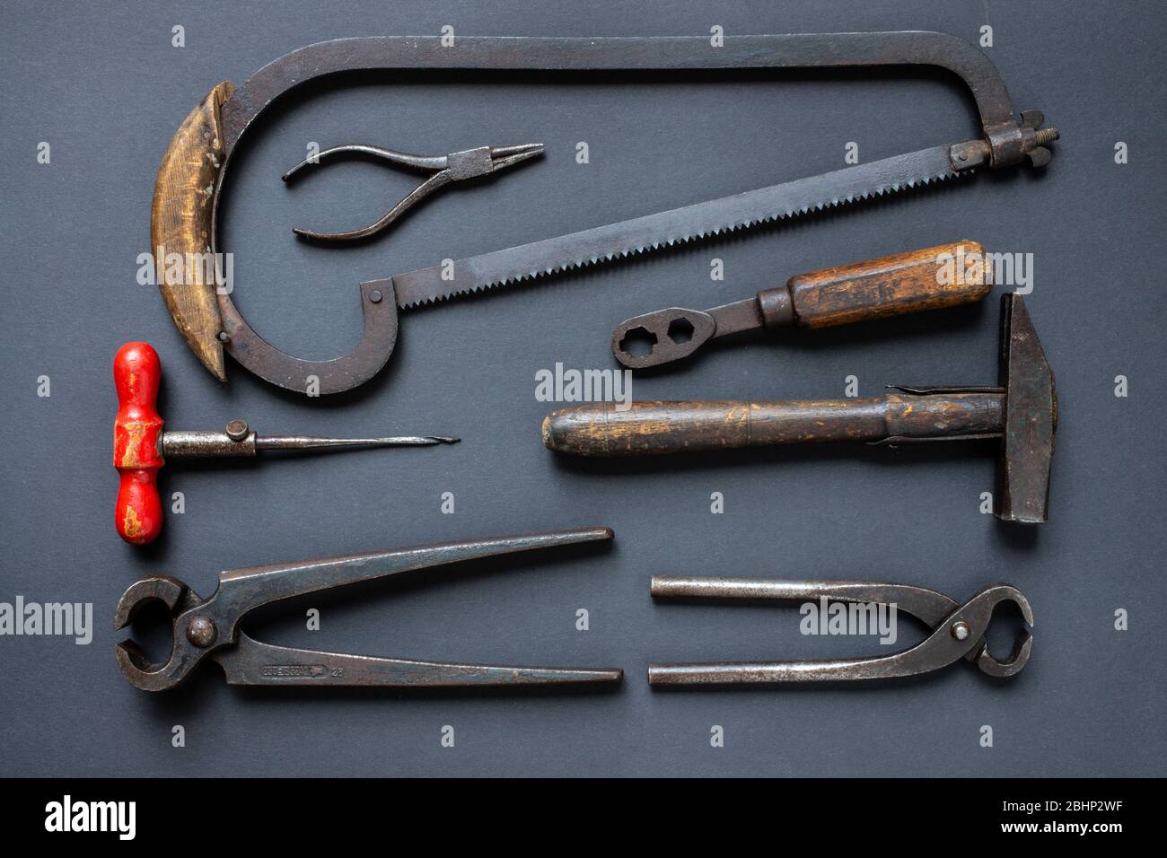 very old tools on black background Stock Photo - Alamy