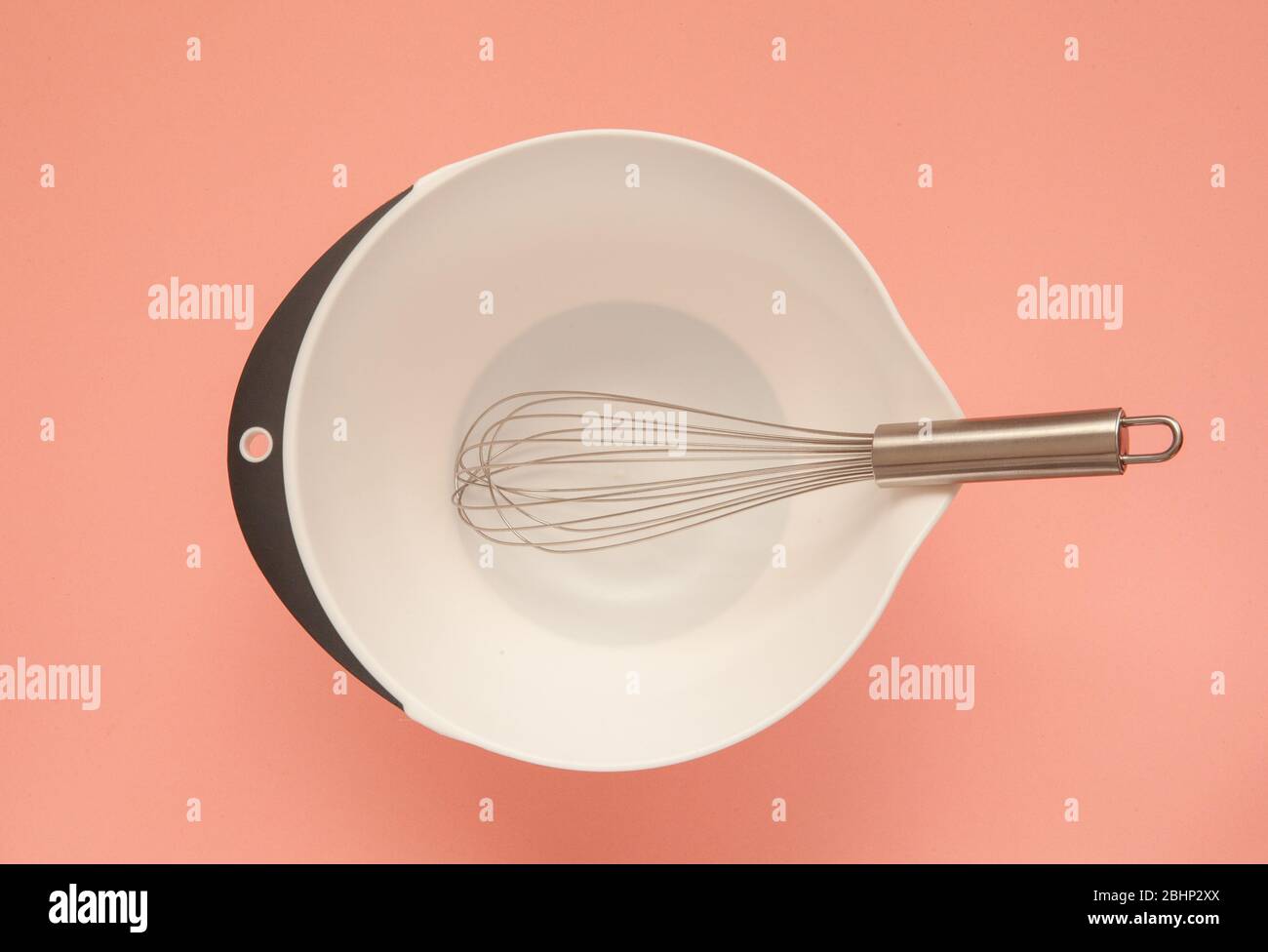 Whisk and a plastic cup for whipping on a pink background Stock Photo ...