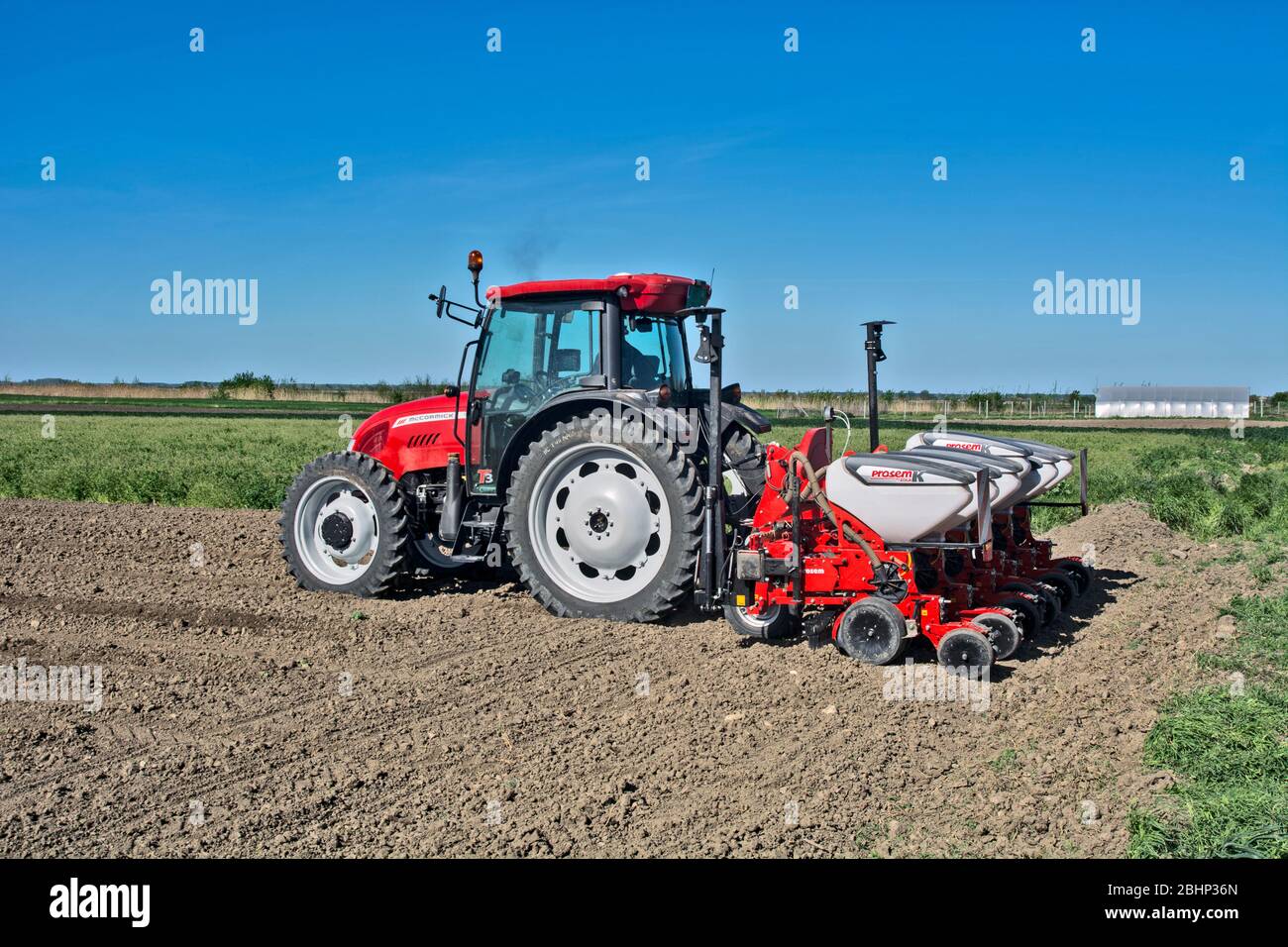 Curug, Serbia, April 20, 2018. Spring sowing. A farmer with a tractor ...