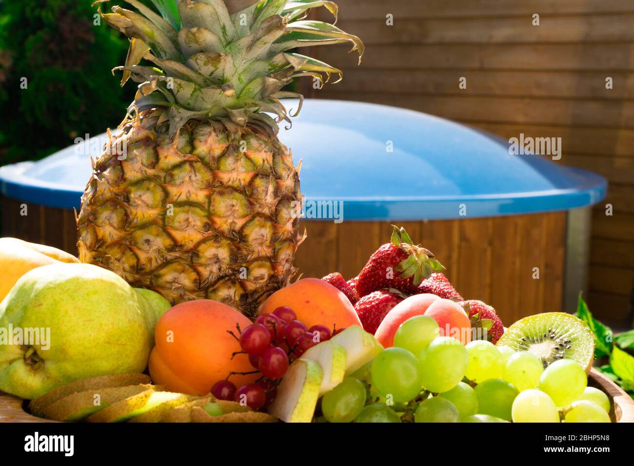 Mix of different exotic fresh colorful fruits on dark wooden table and ...