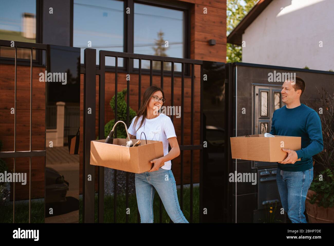 Girl carrying box stairs hi-res stock photography and images - Alamy