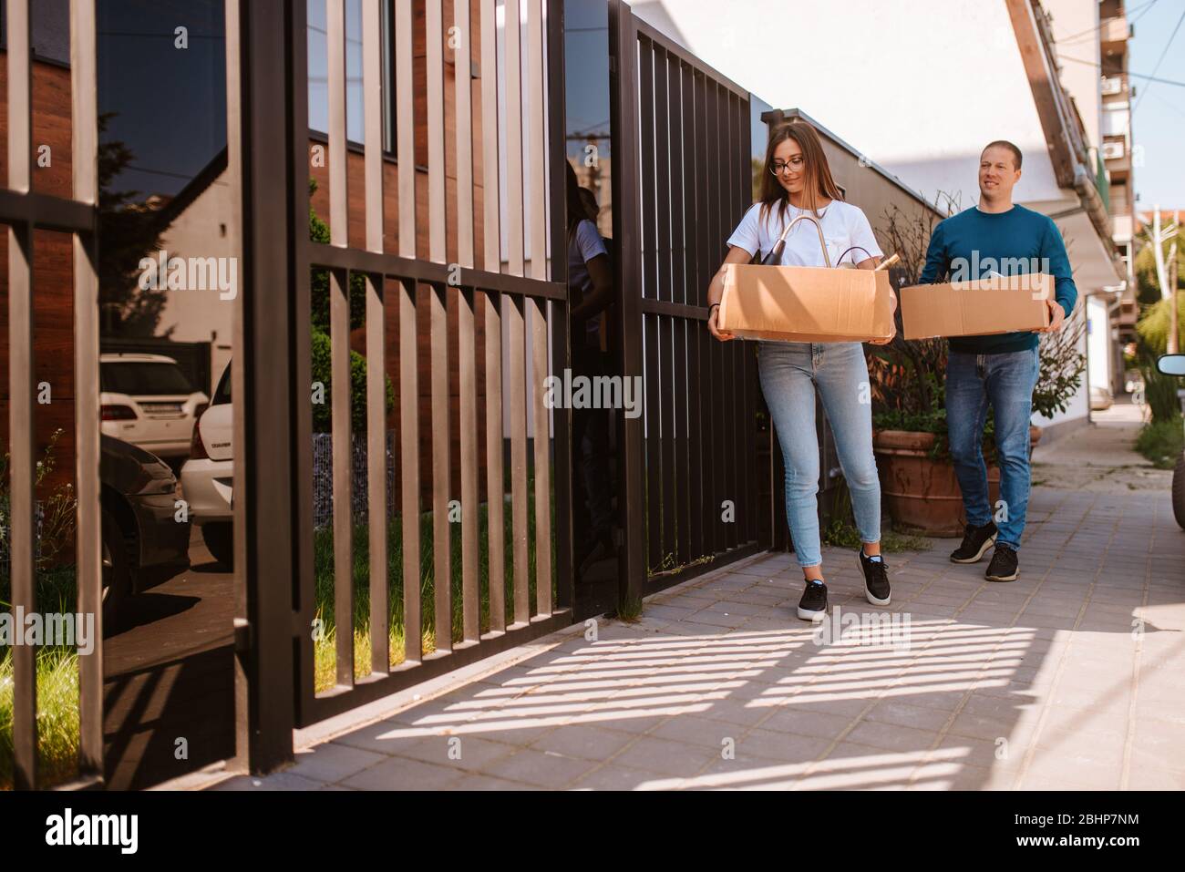 Girl carrying box stairs hi-res stock photography and images - Alamy