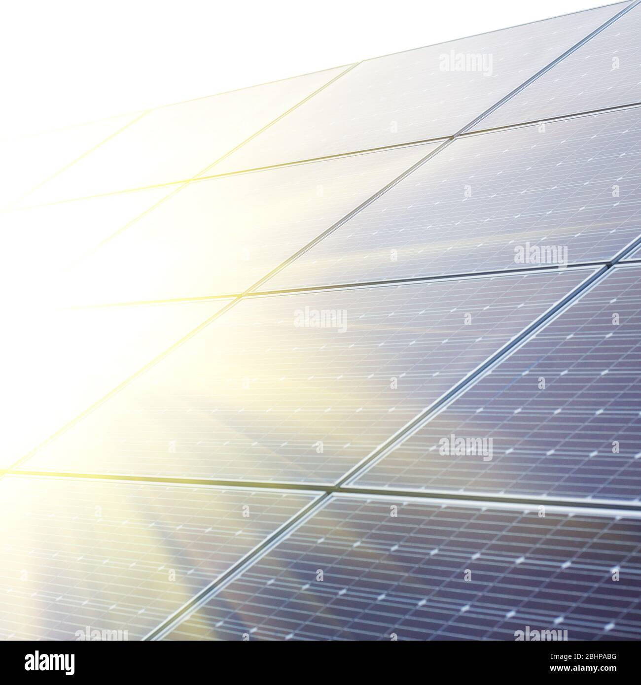 Sun shining to solar panels close up at sunset time on the solar power ...