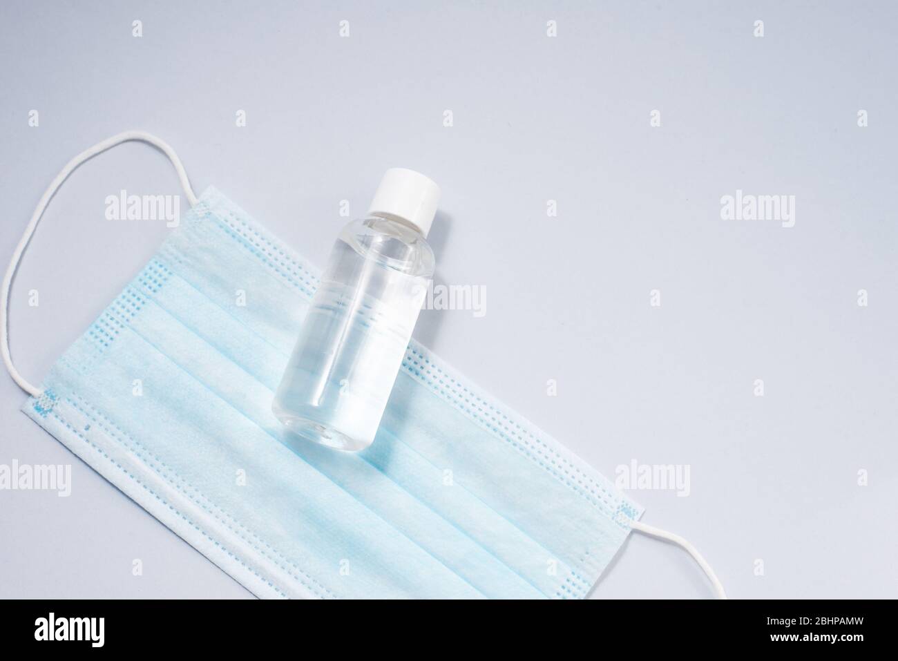 Antiseptic and protective mask for the respiratory tract on a blue ...