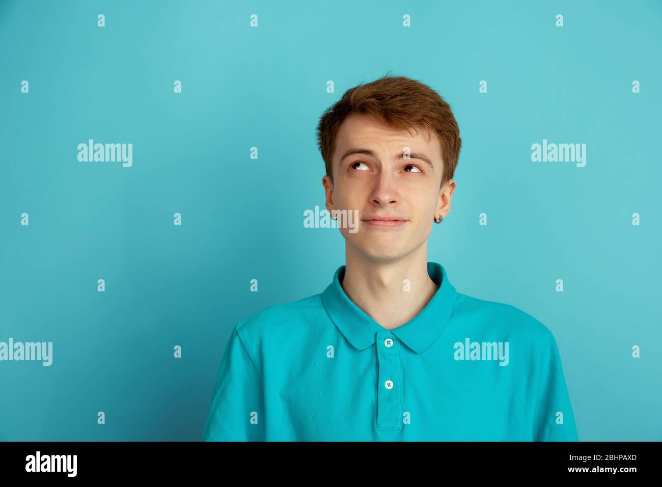 Thinking, dreaming. Caucasian young man's modern portrait isolated on ...