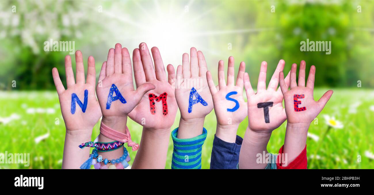 Children Hands Building Word Namaste Means Hello, Grass Meadow Stock ...