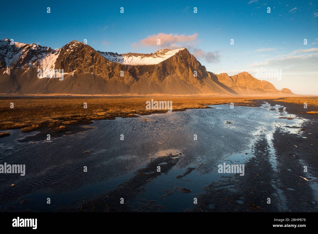 The black sand spit and mountainous backdrop at Eystrahorn, Iceland ...