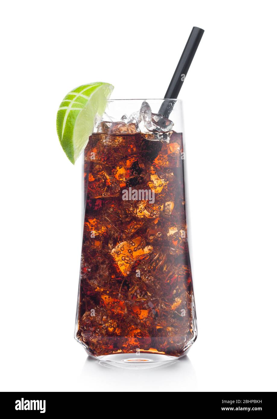 Cuba Libre Cocktail in luxury tall glass with ice cubes and slices of ...