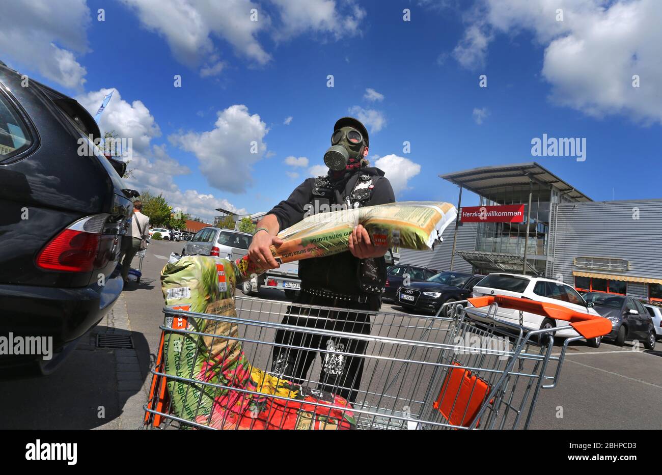 Kaufbeuren, Germany. 27th Apr, 2020. A young man wearing a gas mask ...