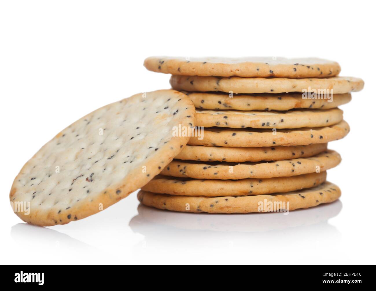 Stack of round organic crispy wheat and five grain salty crackers with ...