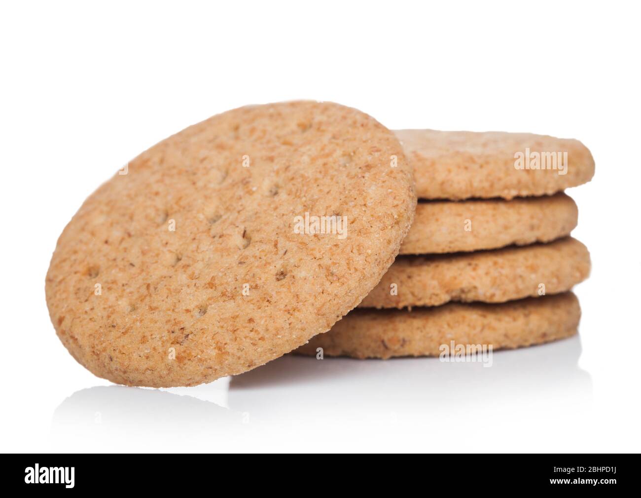 Stack of round organic crispy wheat and five grain salty crackers on ...