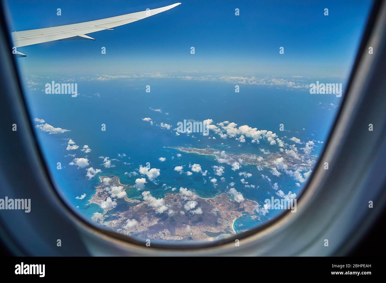 Saint Martin and Anguilla Caribbean islands seen frome airplane window ...