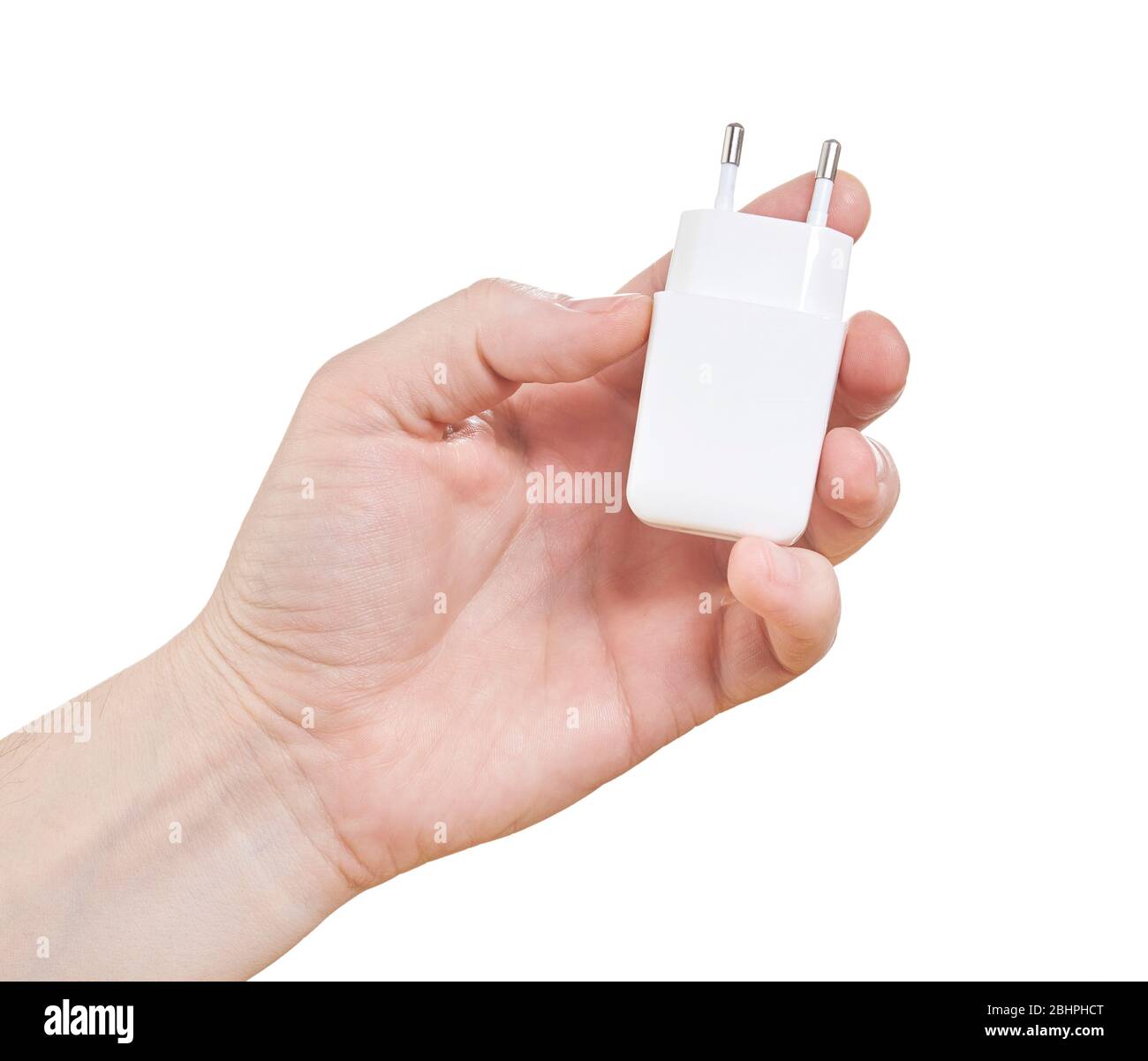 White charger and adapter for mobile phone or smartphone hold by hand ...