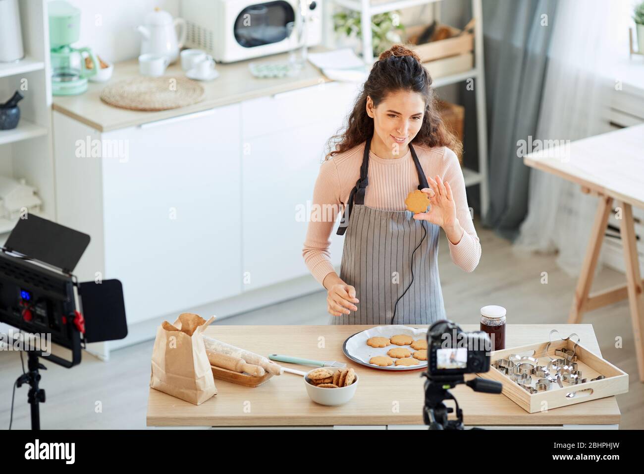 Horizontal high angle shot of young adult woman standing alone in her ...