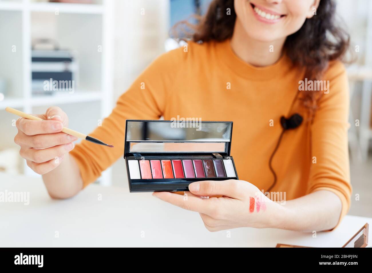 Modern make-up artist testing new lipstick palette colours doing ...