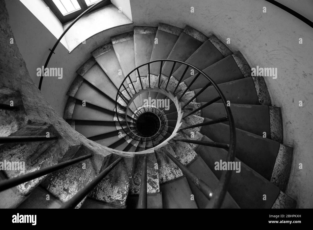 Spiral stairs of an old Italian palace. Overhead view of the spiral ...