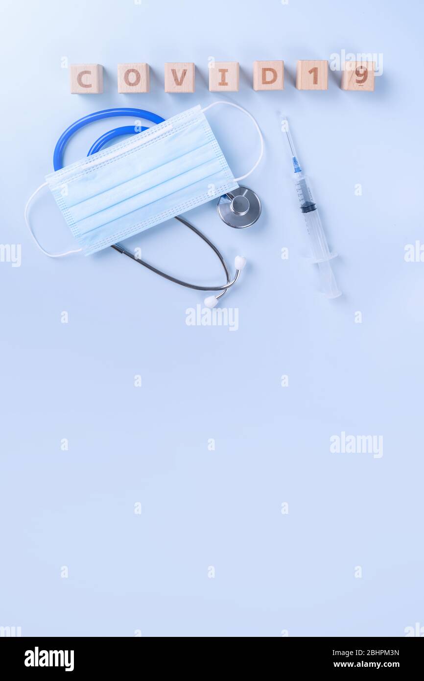 COVID-19 word wooden cube with mask, medical equipment, world disease ...