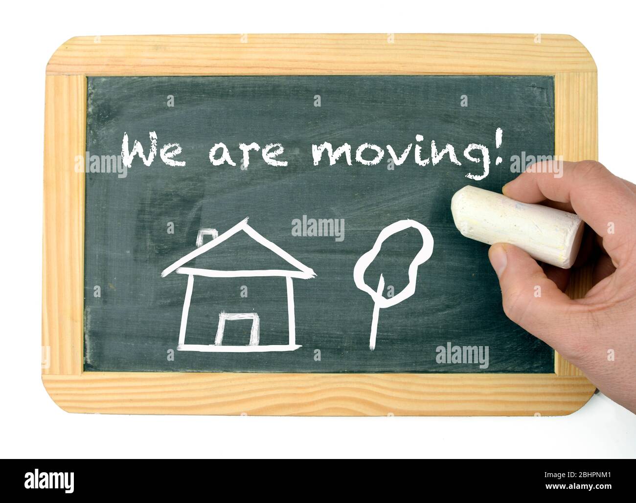 We are moving chalkboard on white background Stock Photo - Alamy