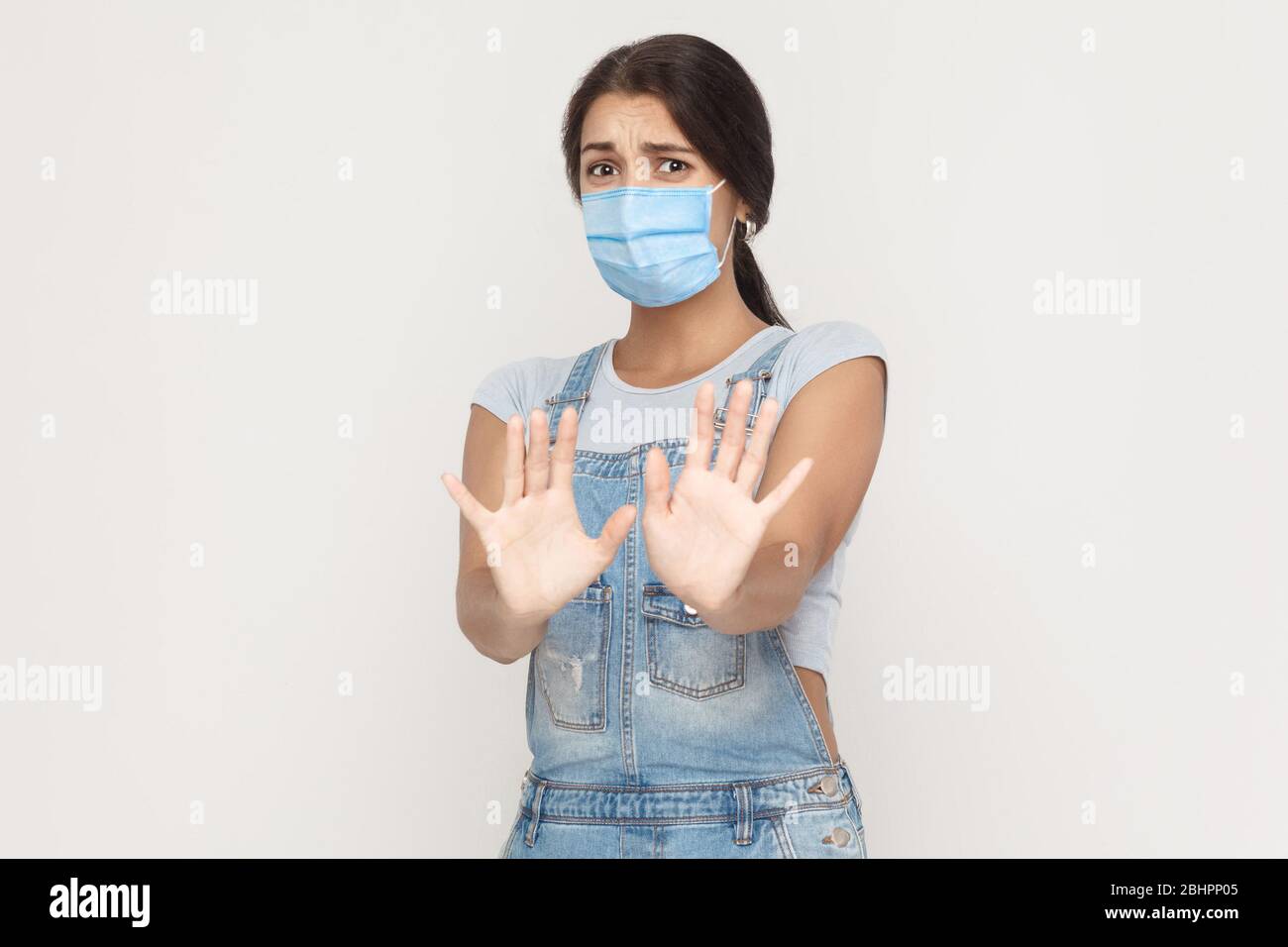 No, please wait, stop. Portrait of scared young brunette woman with ...