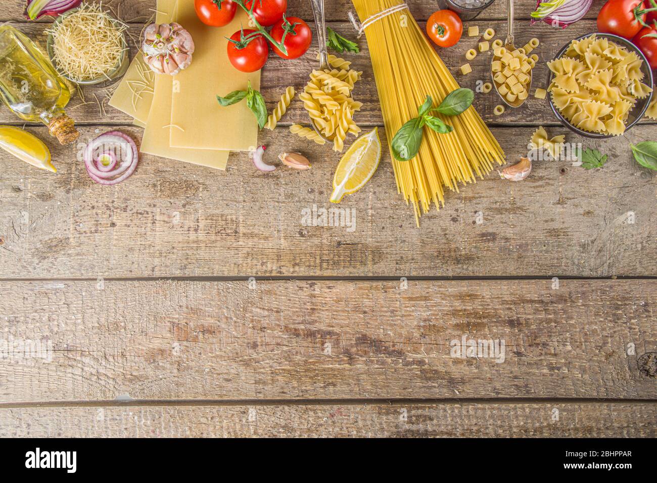 Assortment set of various raw pasta and condiments. Cooking italian ...