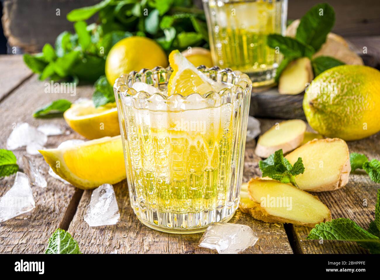 Homemade ginger lemonade cocktail. Cold summer ginger lemon ale. Sweet ...