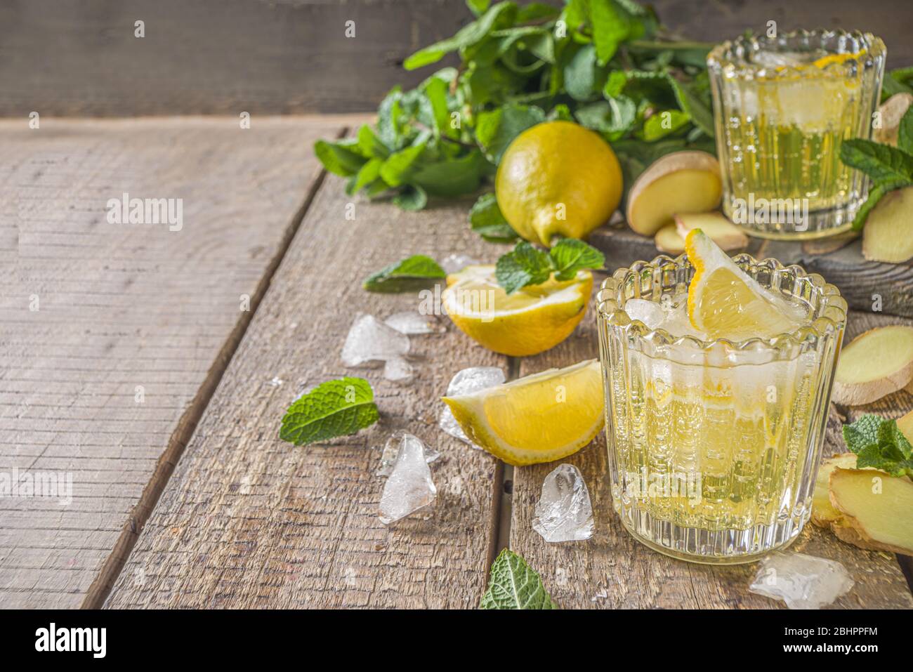 Homemade ginger lemonade cocktail. Cold summer ginger lemon ale. Sweet ...