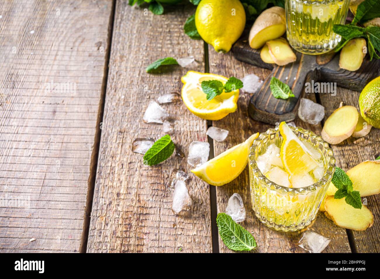 Homemade ginger lemonade cocktail. Cold summer ginger lemon ale. Sweet ...