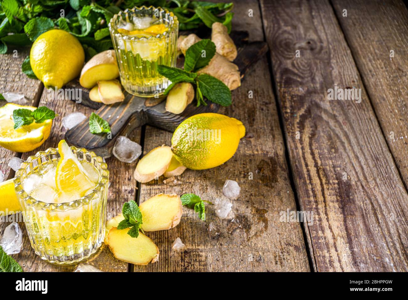 Homemade ginger lemonade cocktail. Cold summer ginger lemon ale. Sweet ...