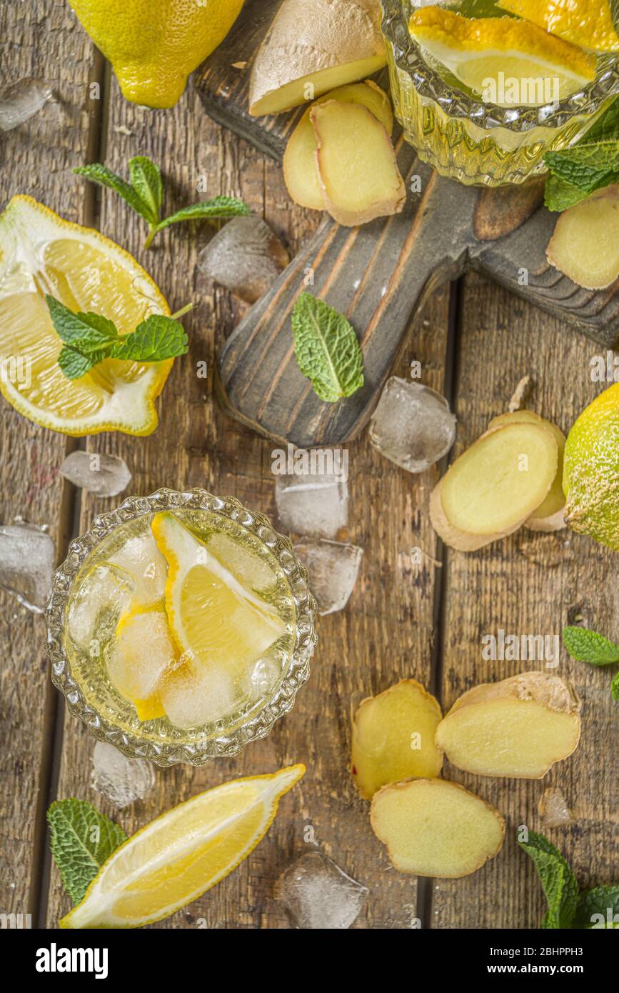 Homemade ginger lemonade cocktail. Cold summer ginger lemon ale. Sweet ...