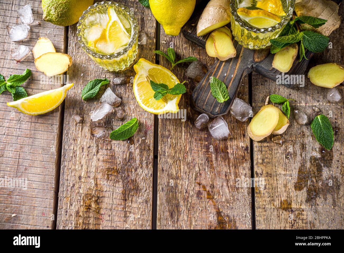 Homemade ginger lemonade cocktail. Cold summer ginger lemon ale. Sweet ...