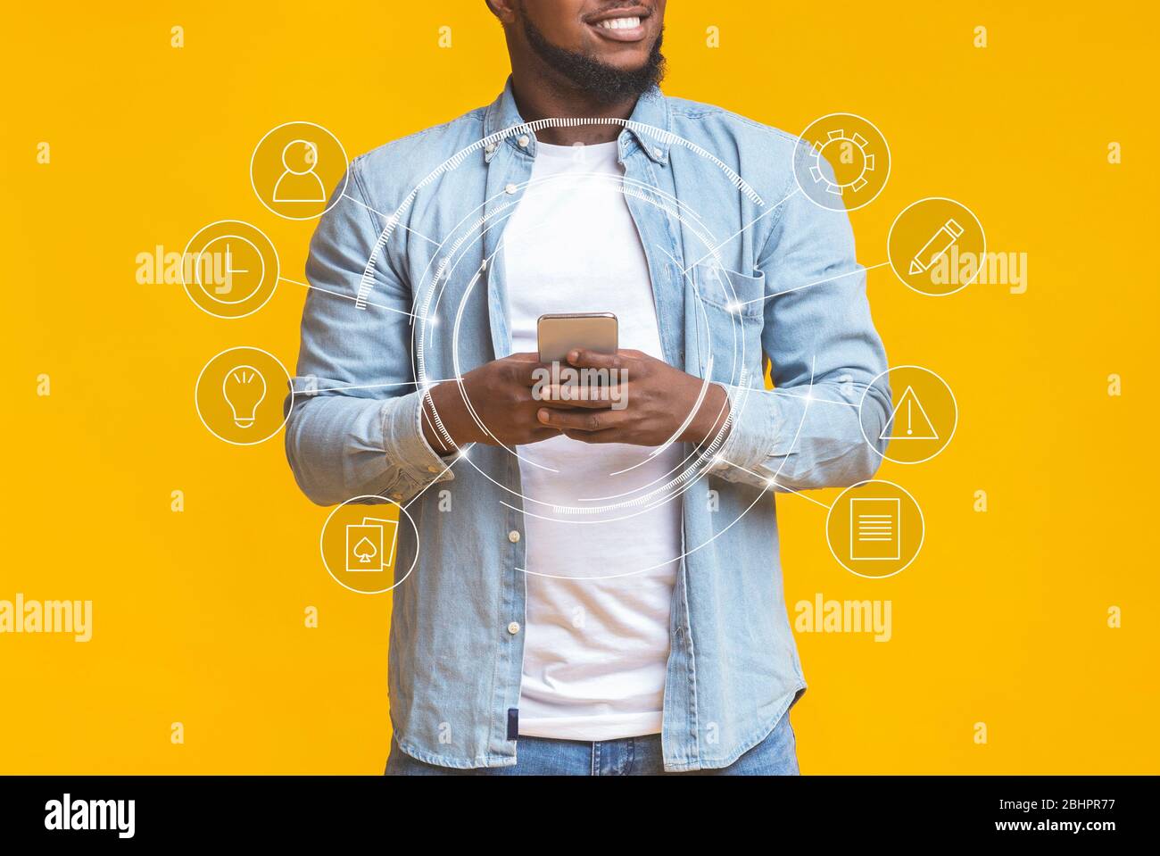 Guy using smart phone with flying network Stock Photo - Alamy