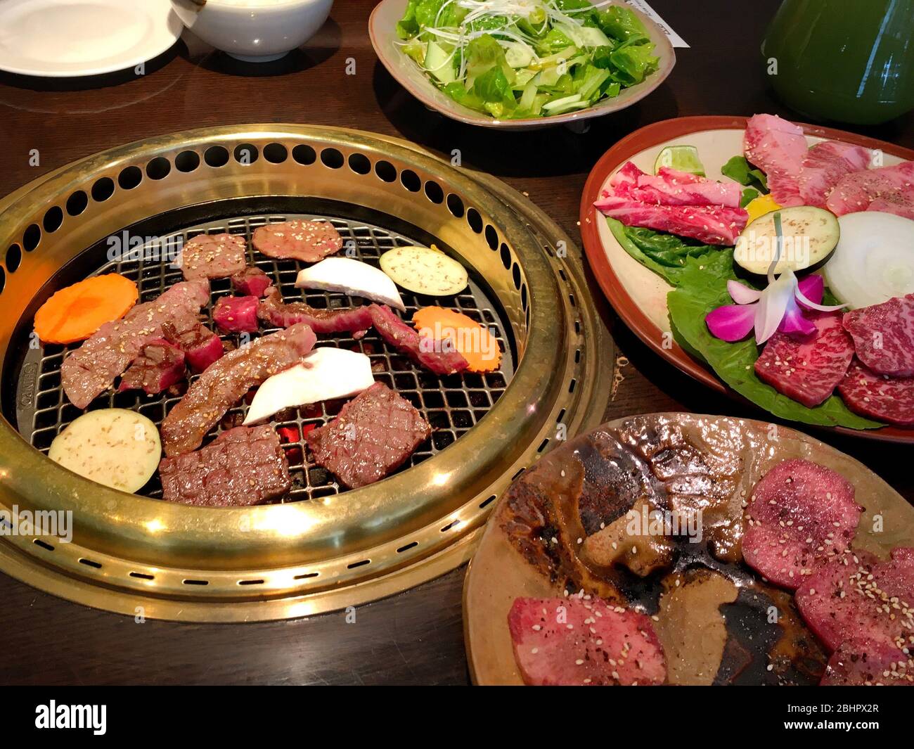 The raw beef slice on coal stove Japanese style Stock Photo - Alamy
