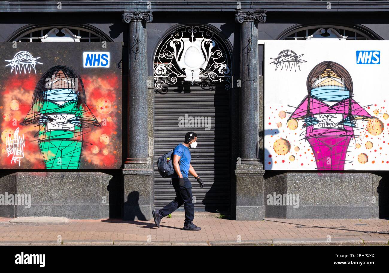 Man walks past Graffiti by Street Artist Nathan Bowen in South London ...