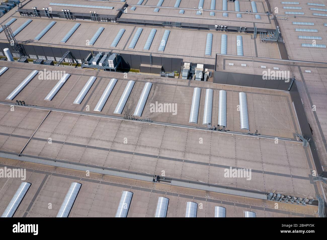Industrial. Aerial view of large roof of factory. Drone shot from above ...