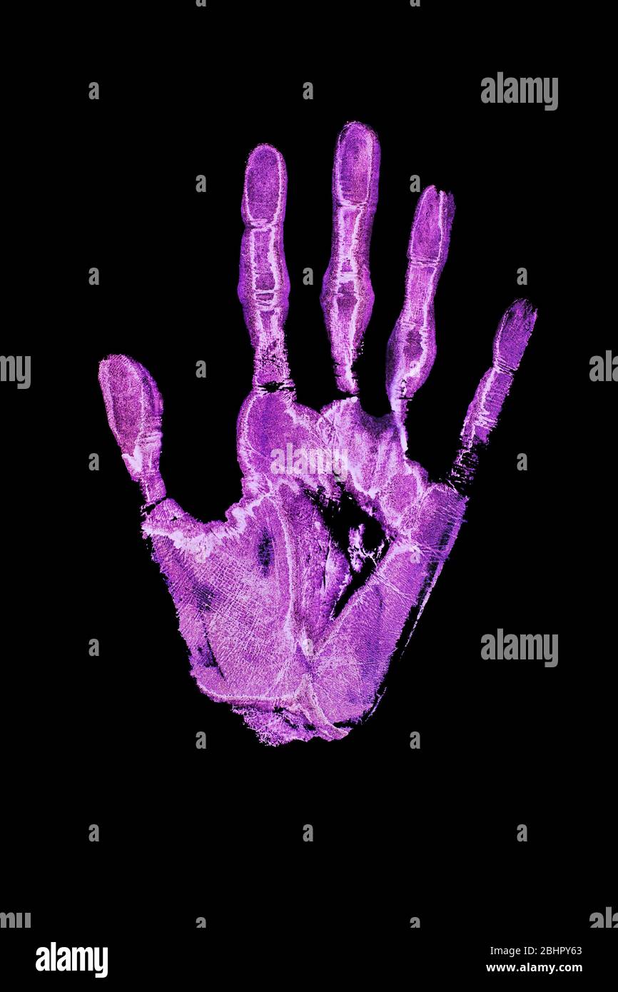 Purple human hand print on black background isolated close up ...