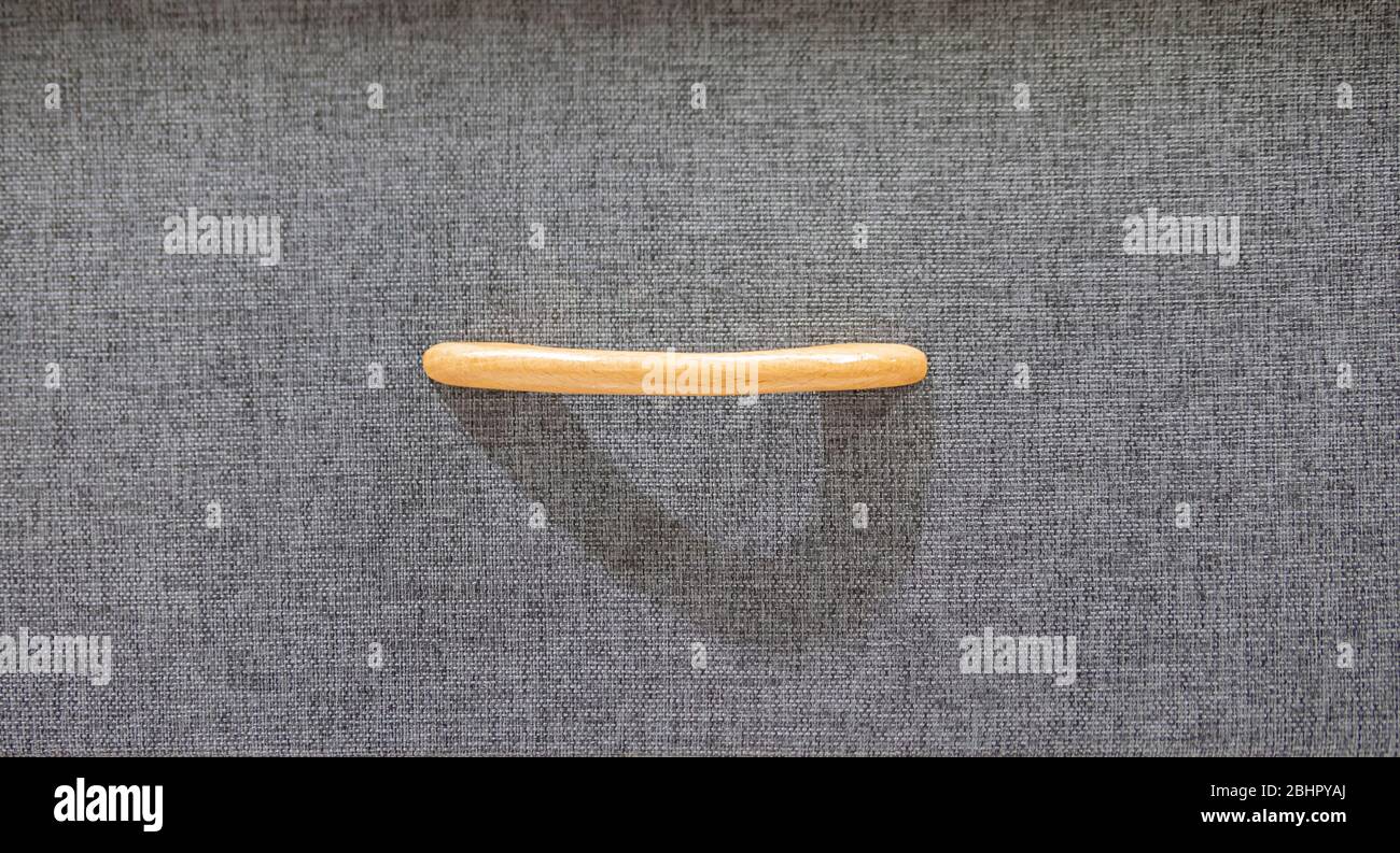 Gray fabric drawers with wood handle Stock Photo - Alamy