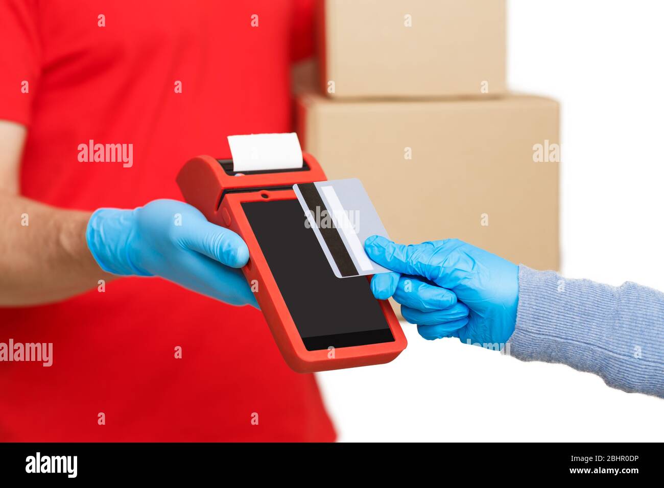 Customer pays for delivery by credit card at terminal Stock Photo - Alamy