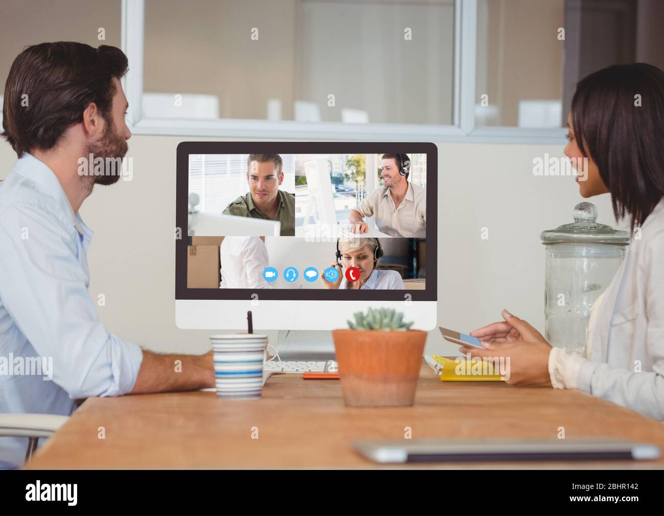 Side view of people during a visio call on computer Stock Photo - Alamy