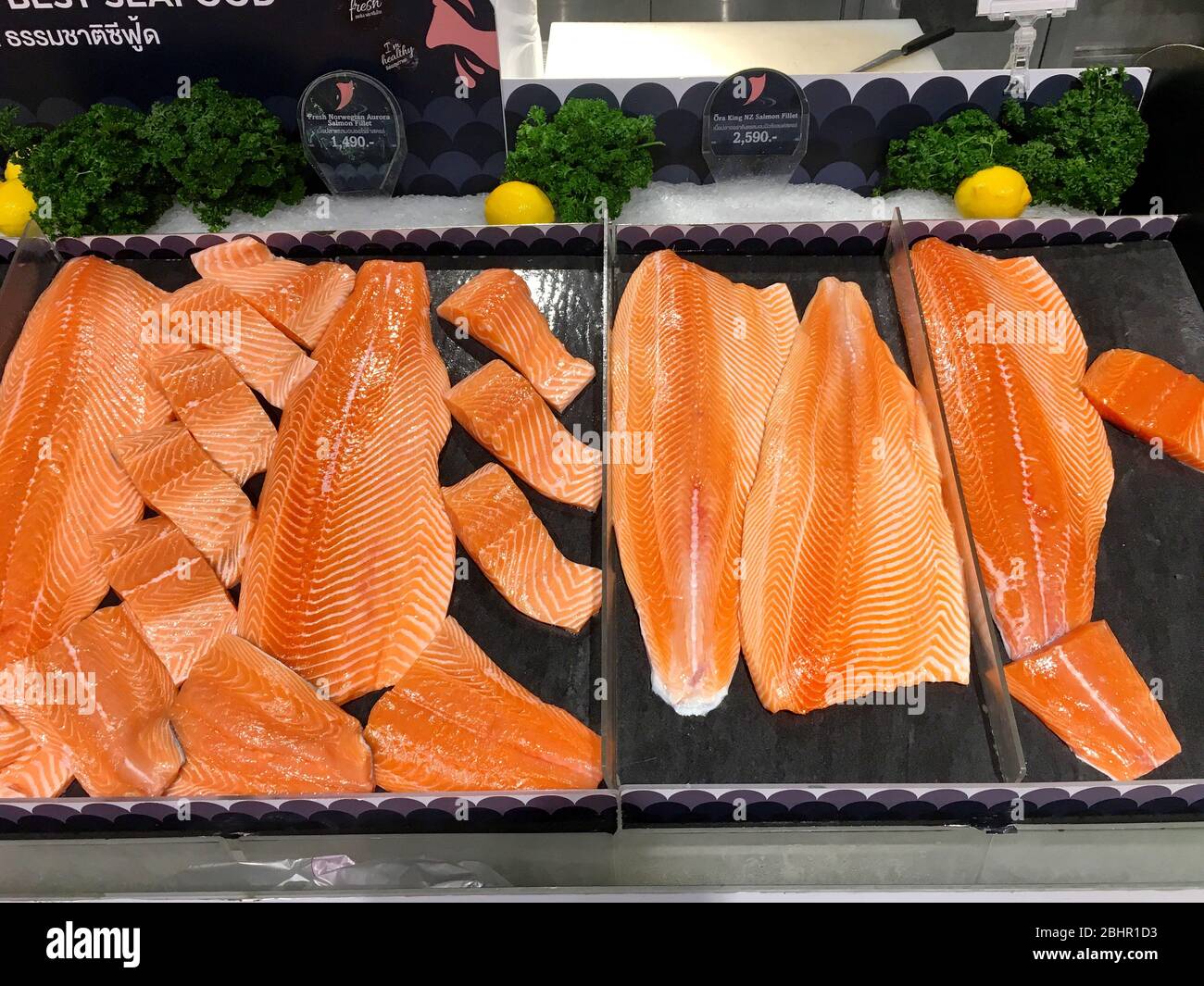 Photo of Many pieces of raw salmon fish for sell in the supermarket of ...