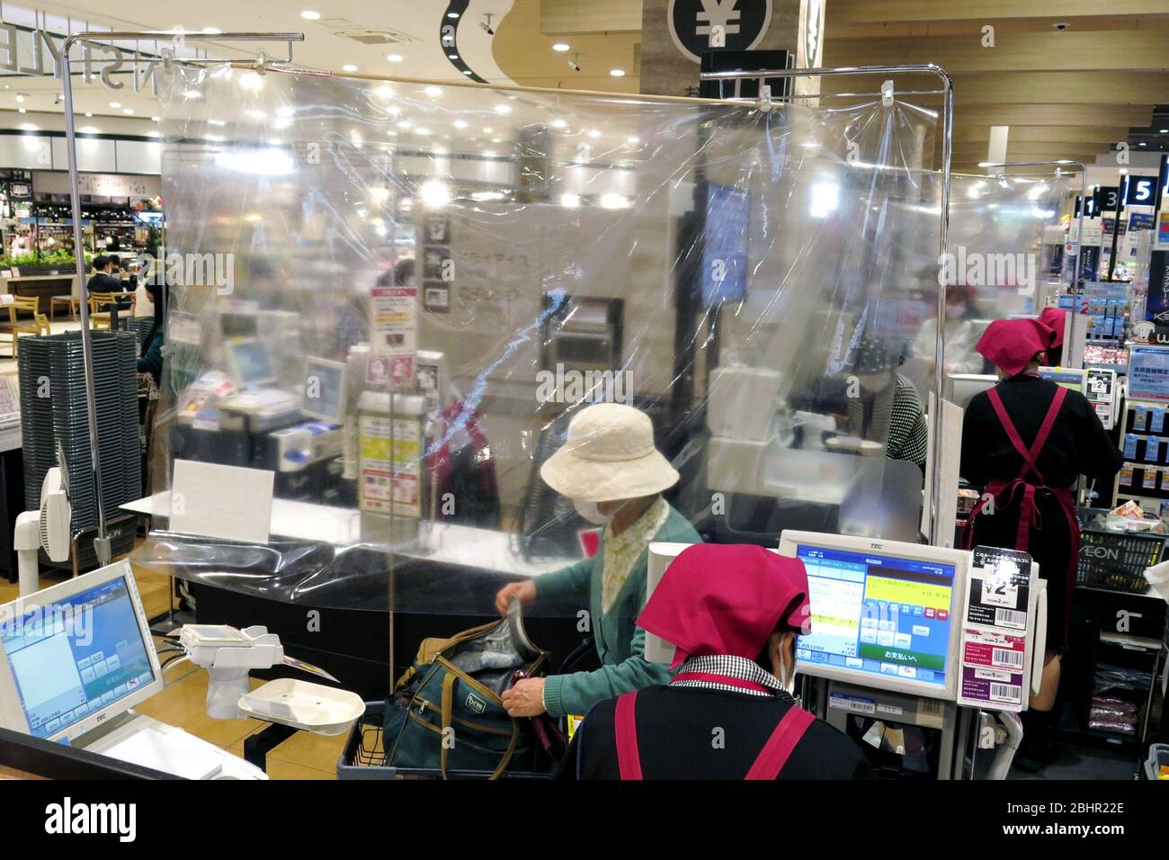 View of a plastic curtain at a checkout counter to prevent infections ...