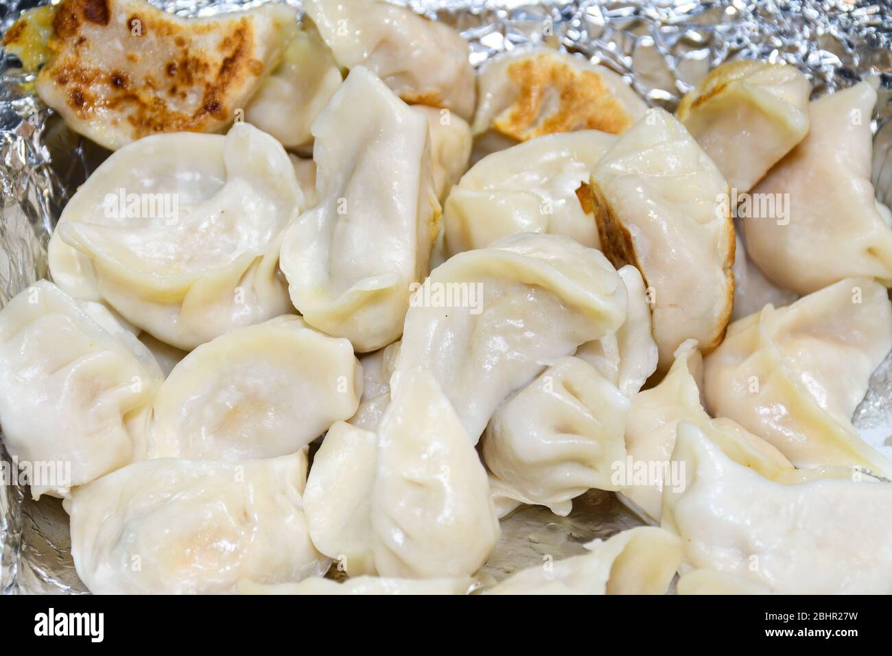 Plate of traditional nepali food momos. Steam cooked momos with sauce ...