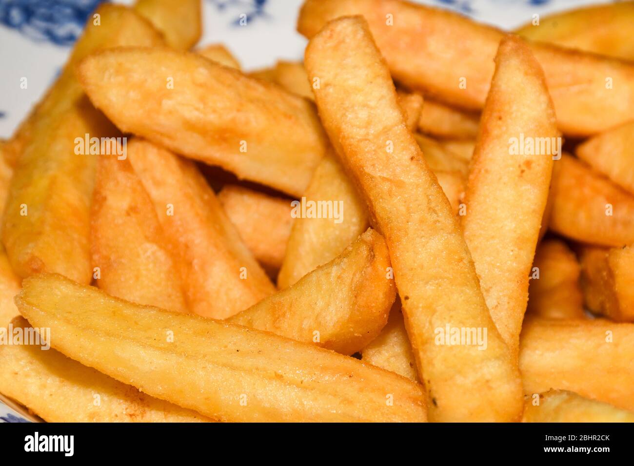 Fresh tasty fried potatoes - appetizing food background. French fries ...