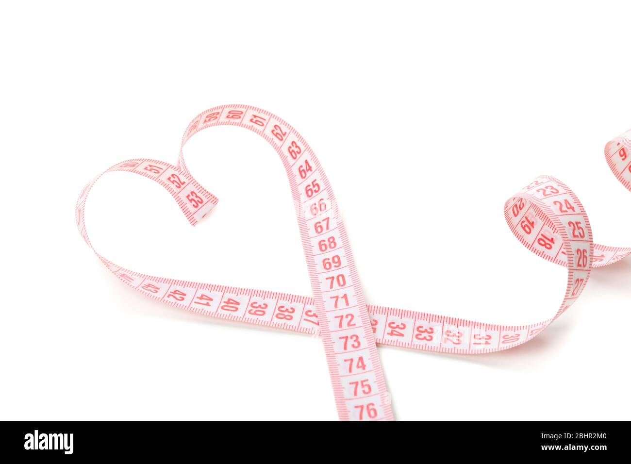 Measuring tape in the form of heart isolated on white background Stock ...