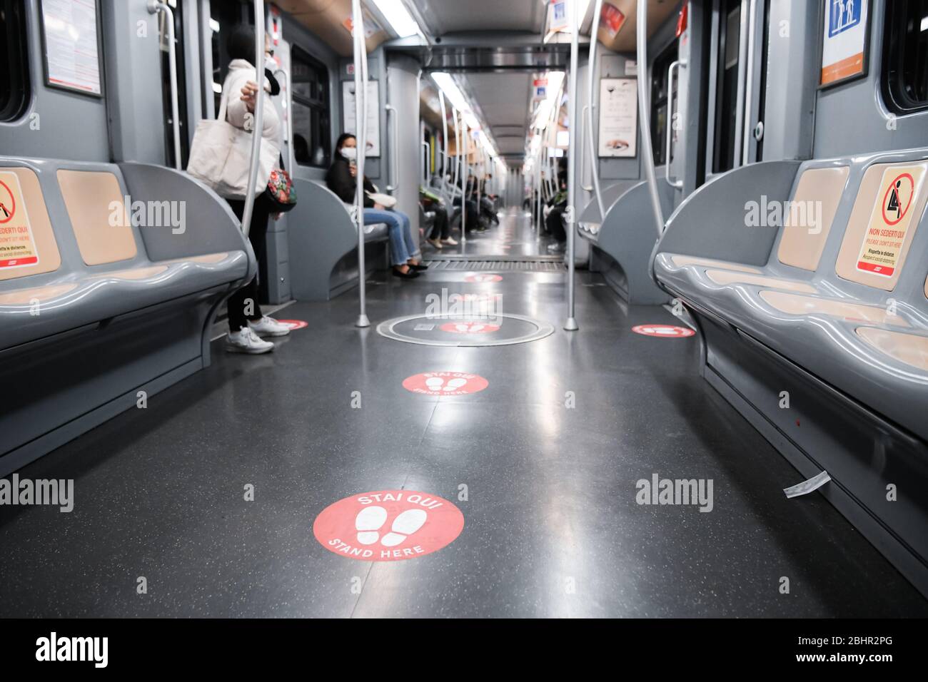 Milan, Italy - April 27, 2020: Social distancing signpostings on the ...